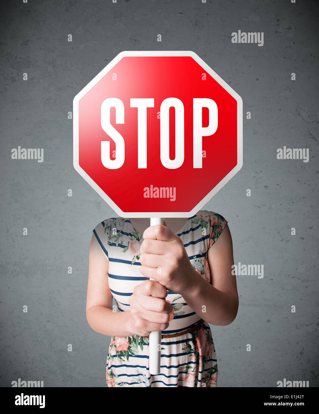 Young woman holding a stop sign Stock Photo - Alamy Young woman holding a stop sign Stock Photo - Alamy