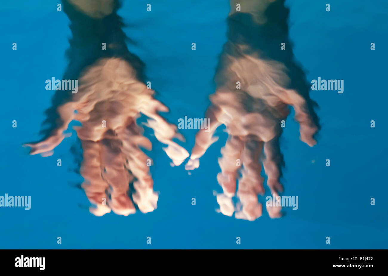 Two hands under water Stock Photo - Alamy
