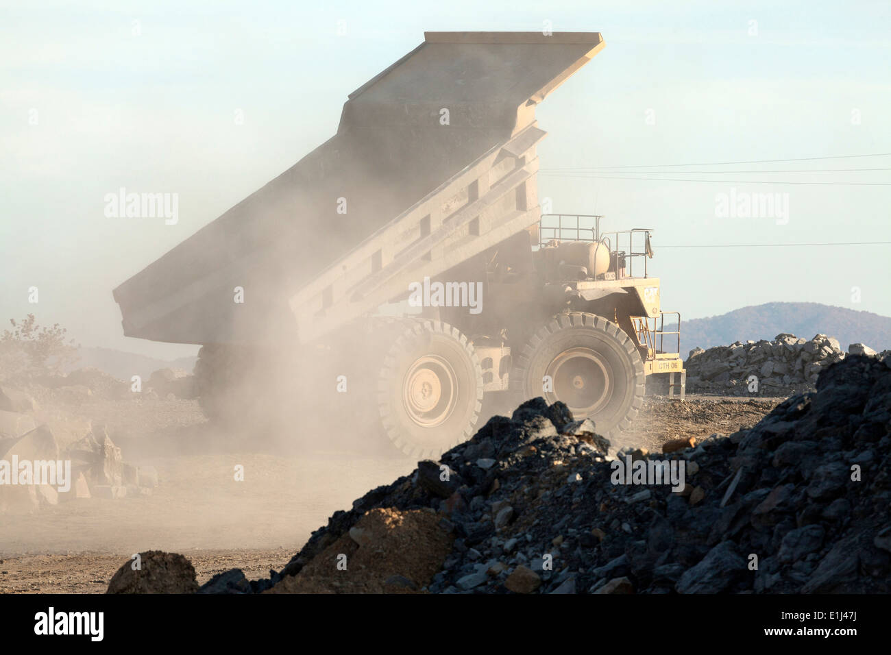 Coal mining dump truck on dusty excavated mountaintop, Appalachia, Wise ...
