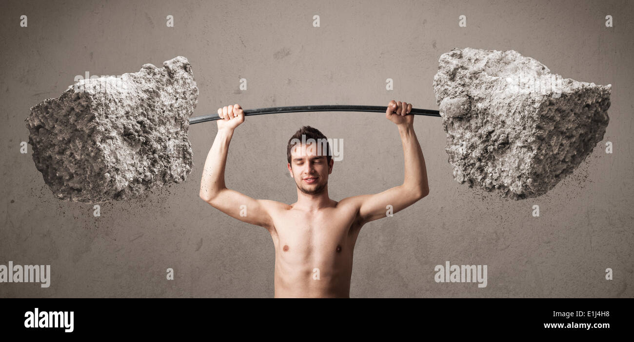 skinny guy lifting large rock stone weights Stock Photo - Alamy
