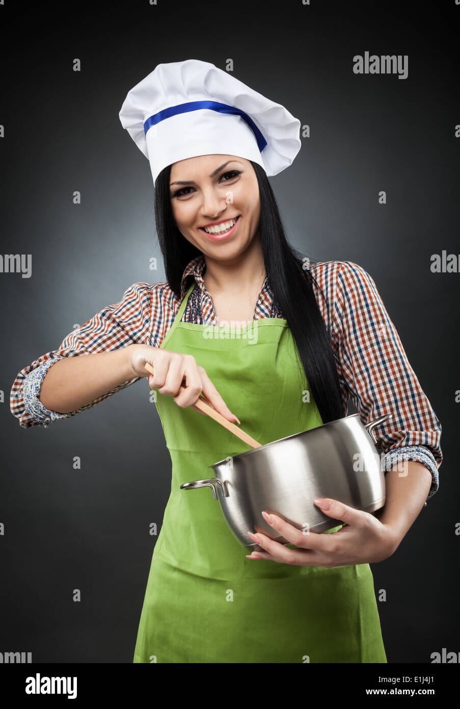 Gorgeous latin woman cook with a stainless steel pot Stock Photo - Alamy