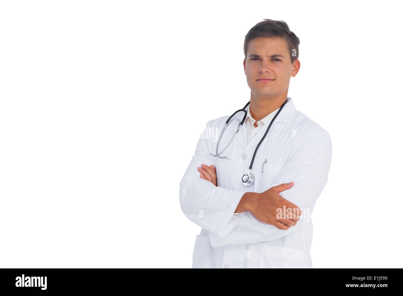 Doctor smiling with arms crossed Stock Photo - Alamy