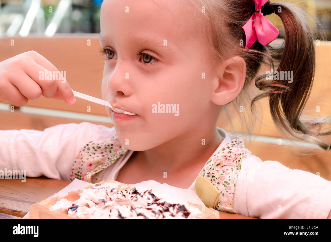 little girl eating waffles Stock Photo - Alamy