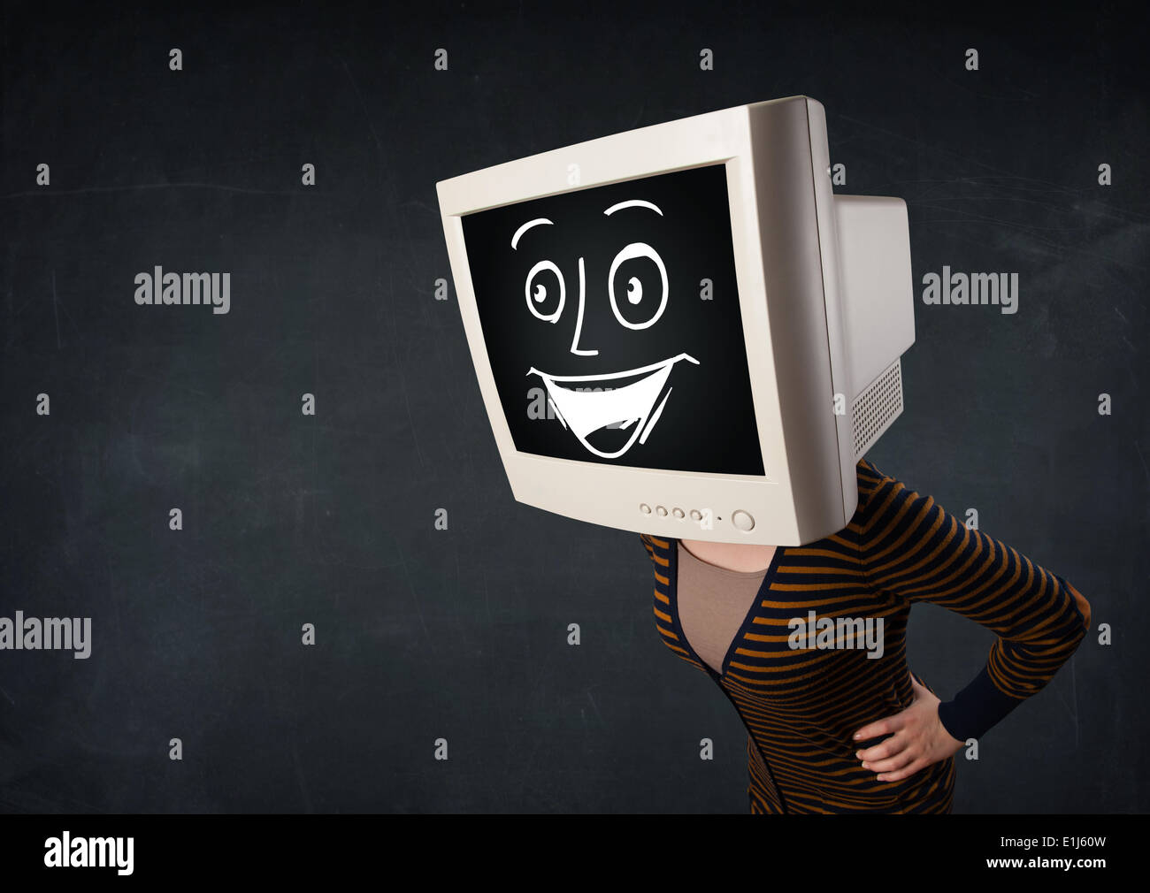 Girl with a monitor head and a cheerful cartoon face Stock Photo - Alamy