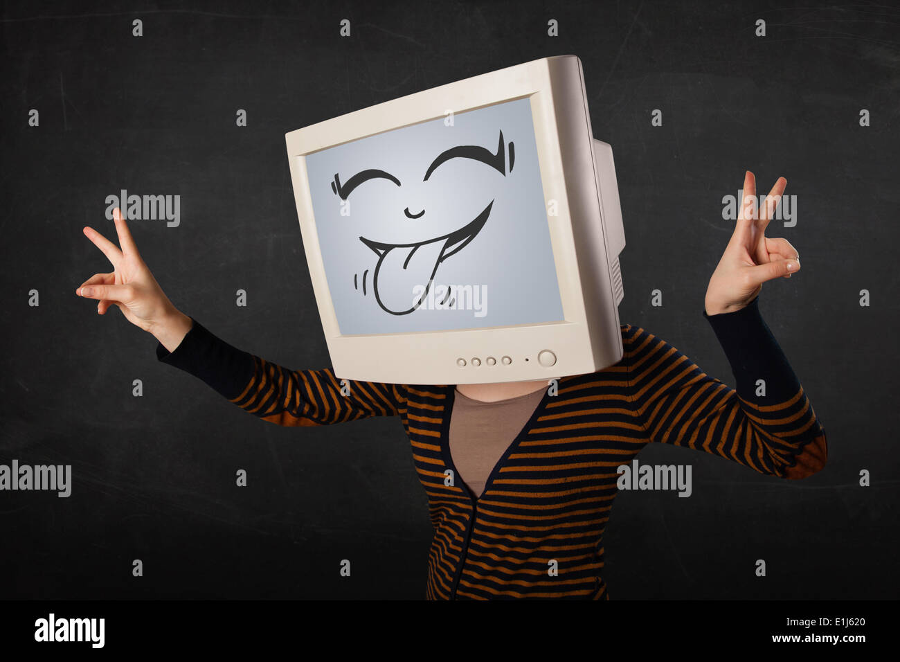 Young girl wearing a monitor with a funny face Stock Photo - Alamy