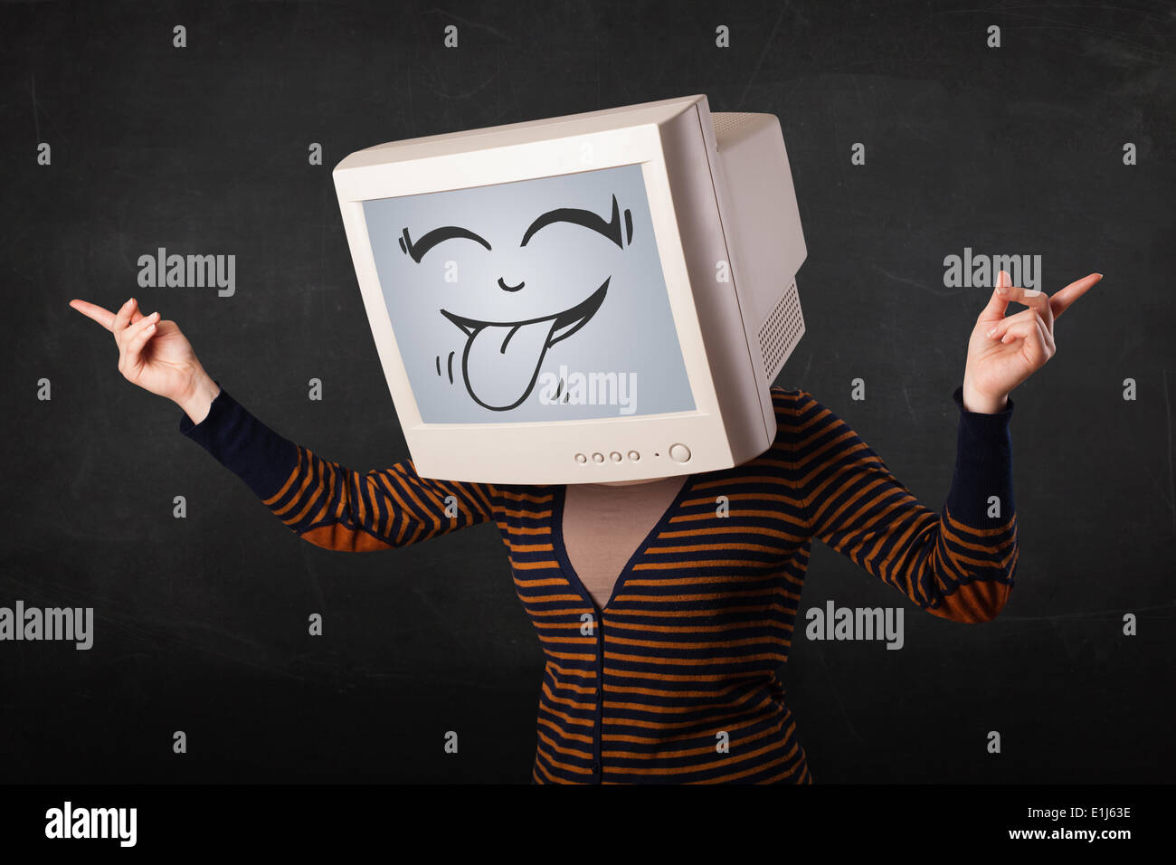 Young girl wearing a monitor with a funny face Stock Photo - Alamy