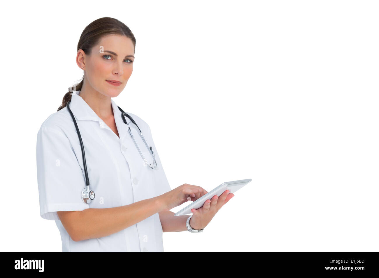 Happy nurse using her tablet Stock Photo - Alamy