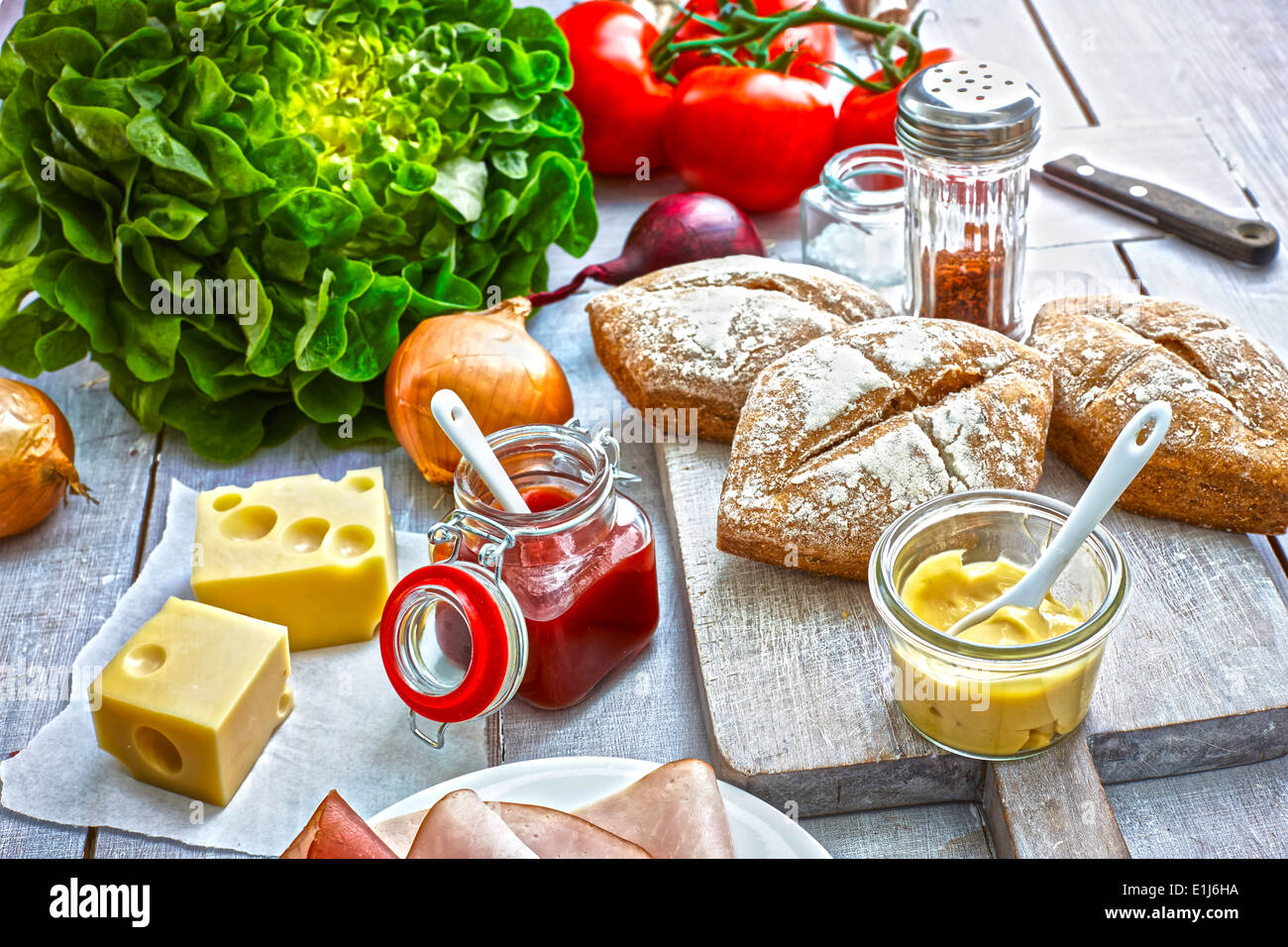 Ingredients of burgers on light ground Stock Photo - Alamy