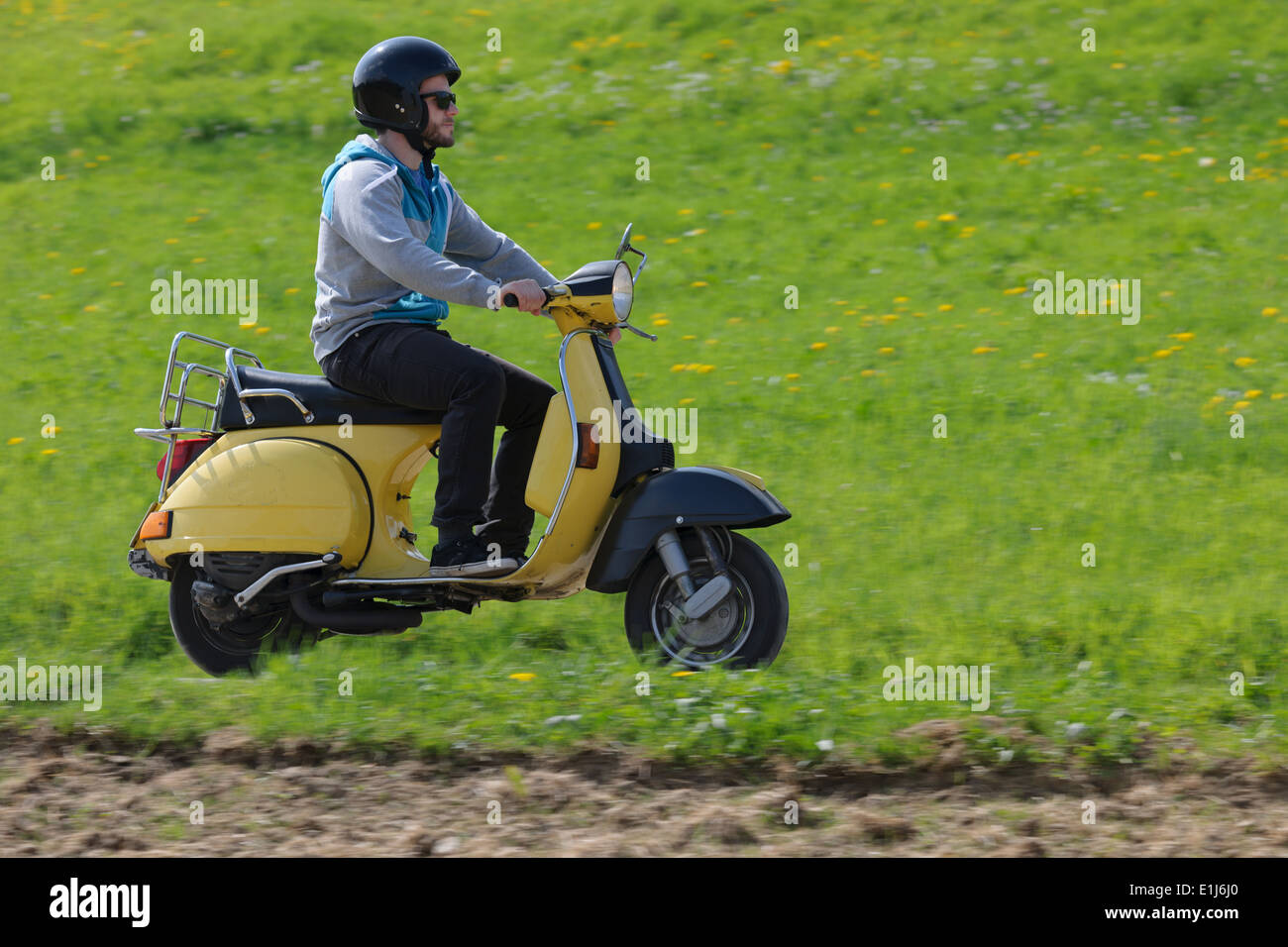 Man with vespa hi-res stock photography and images - Alamy