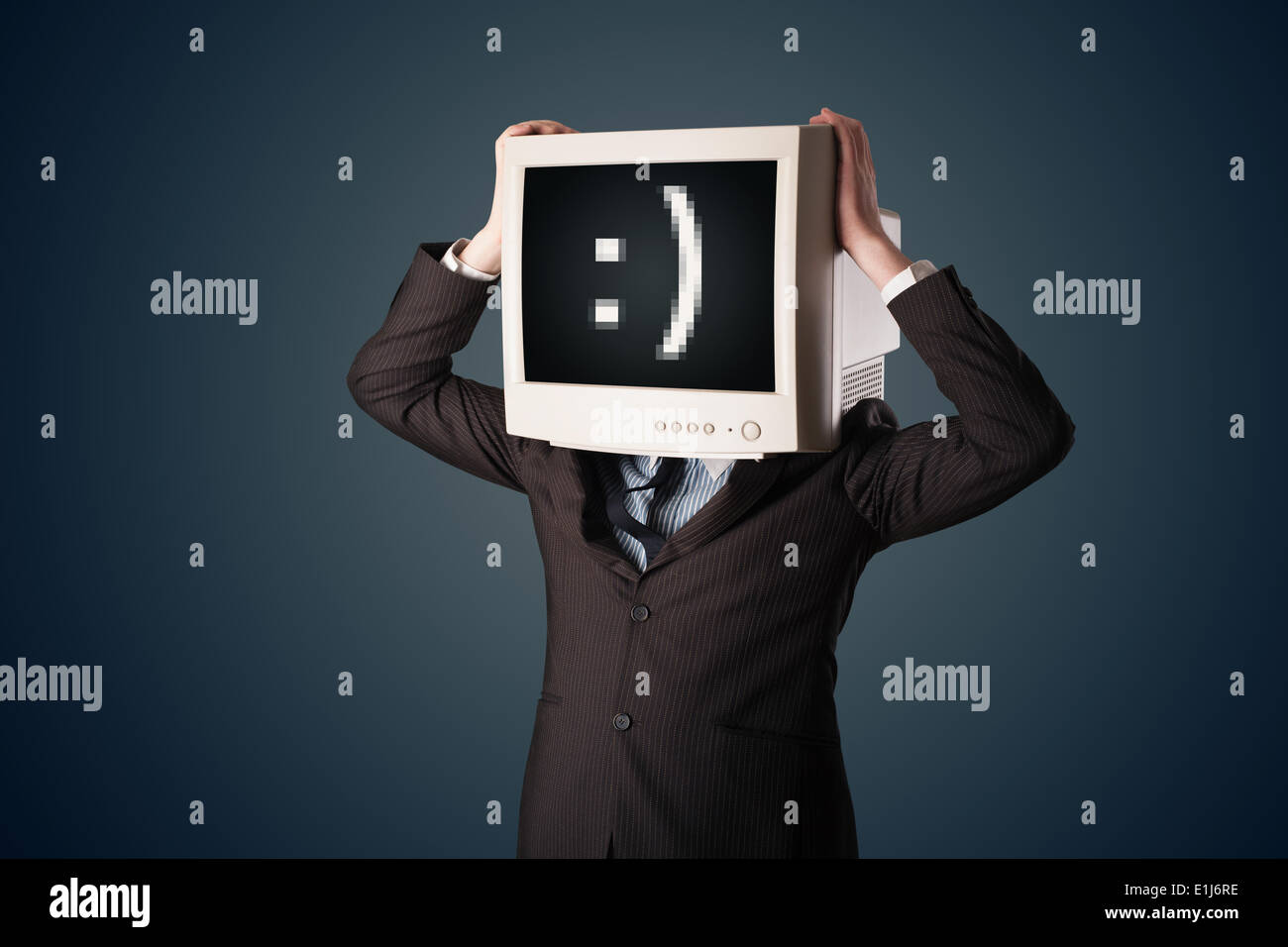 Funny young businessman with a monitor on his head and smiley on the ...