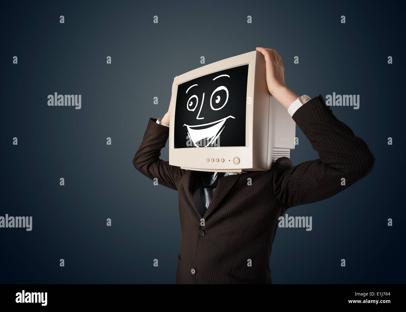 Happy businessman with a PC monitor head and a smiley face Stock Photo ...