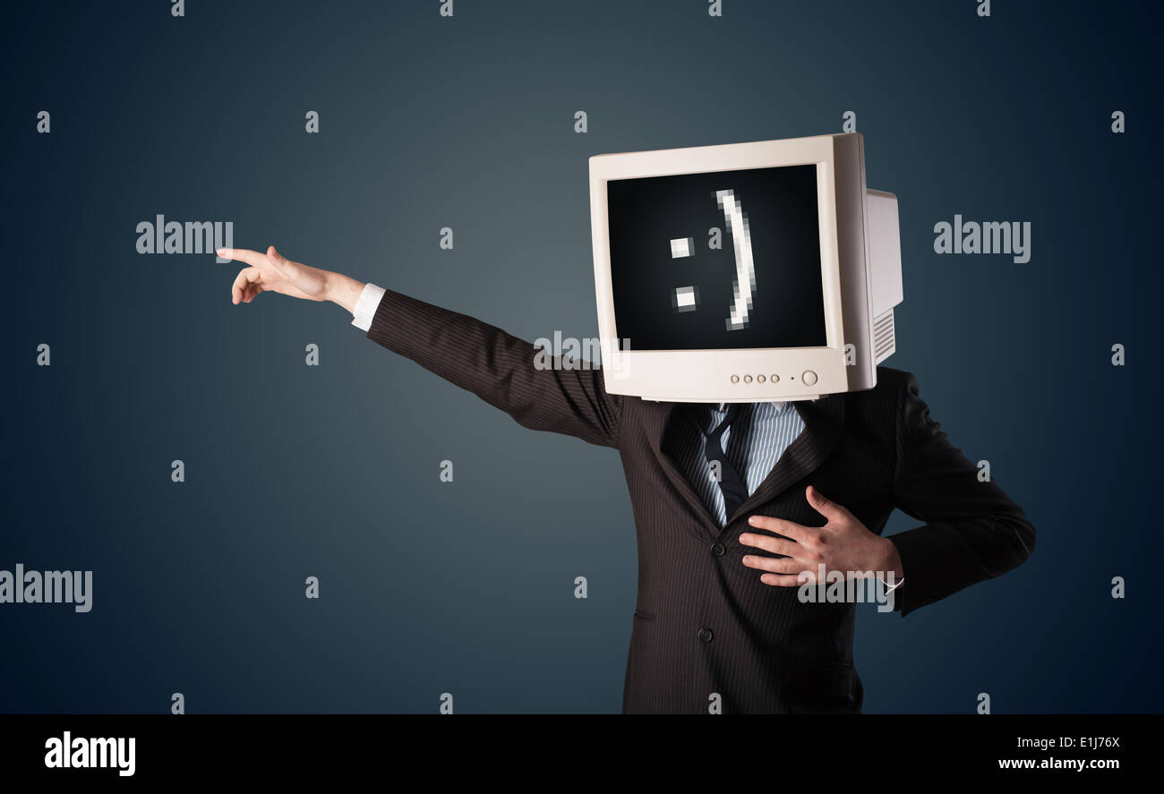Funny young businessman with a monitor on his head and smiley on the ...