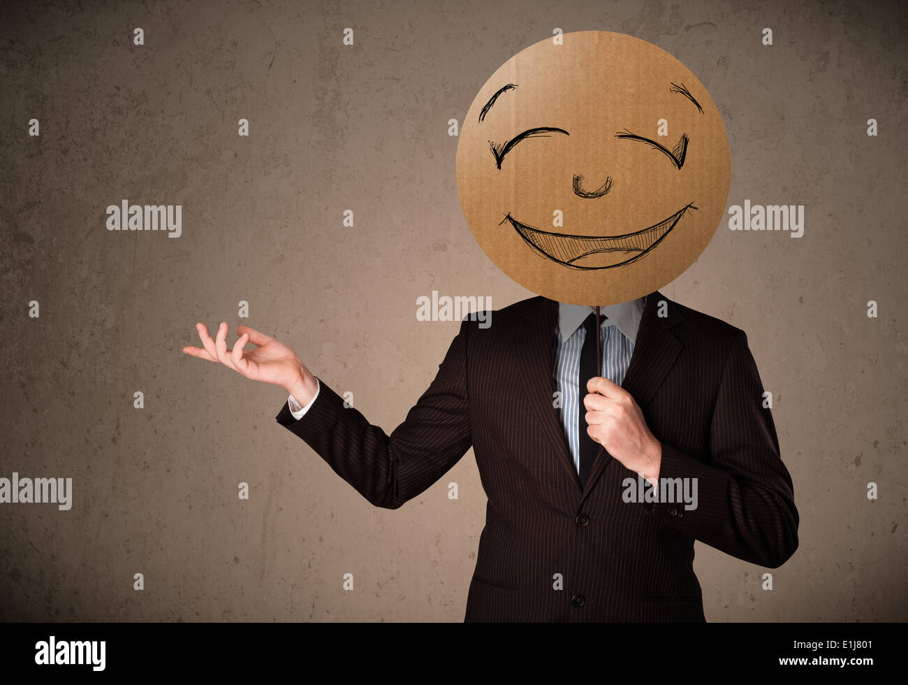 Businessman holding a smiley face board Stock Photo - Alamy