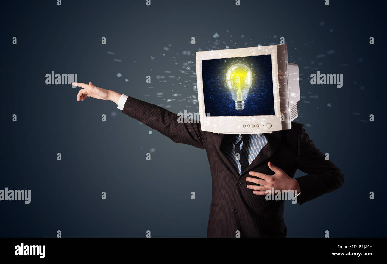 Business man with a pc monitor head and idea light bulb in the display ...