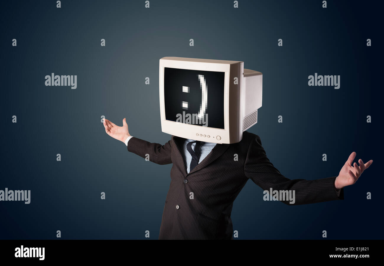 Funny young businessman with a monitor on his head and smiley on the ...