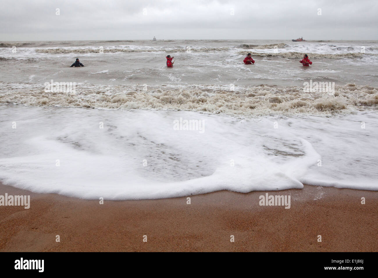 Men wading in ocean waves at Polar Bear Club New Year's Day Plunge ...
