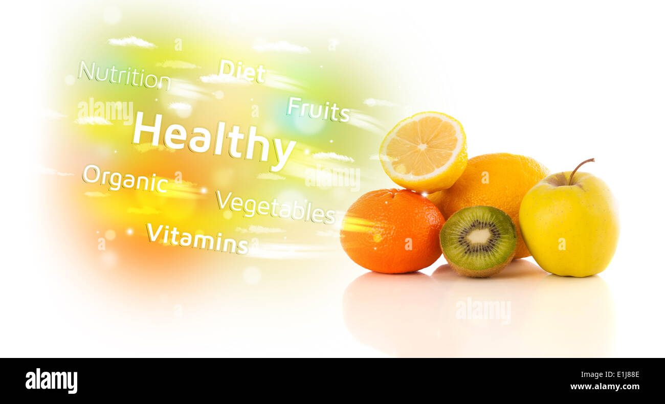 Colorful juicy fruits with healthy text and signs Stock Photo - Alamy