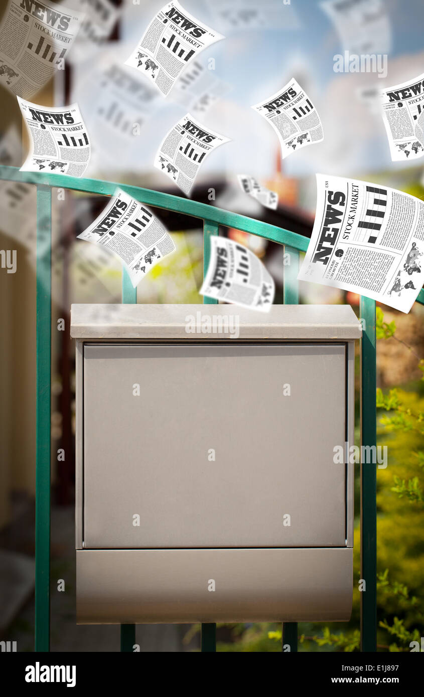 Post box with daily newspapers flying Stock Photo - Alamy