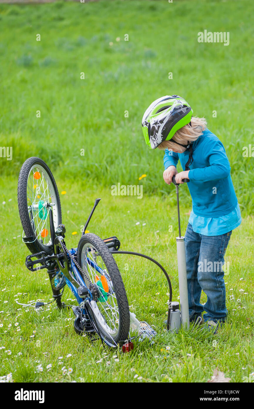 Boy standing bicycle side view hi-res stock photography and images - Alamy
