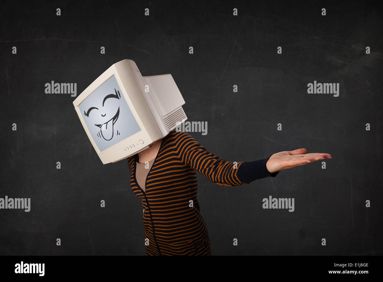 Young girl wearing a monitor with a funny face Stock Photo - Alamy
