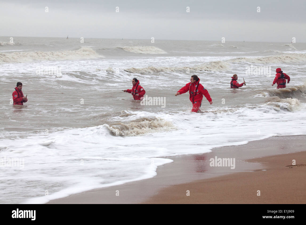 Men wading in ocean waves at Polar Bear Club New Year's Day Plunge ...