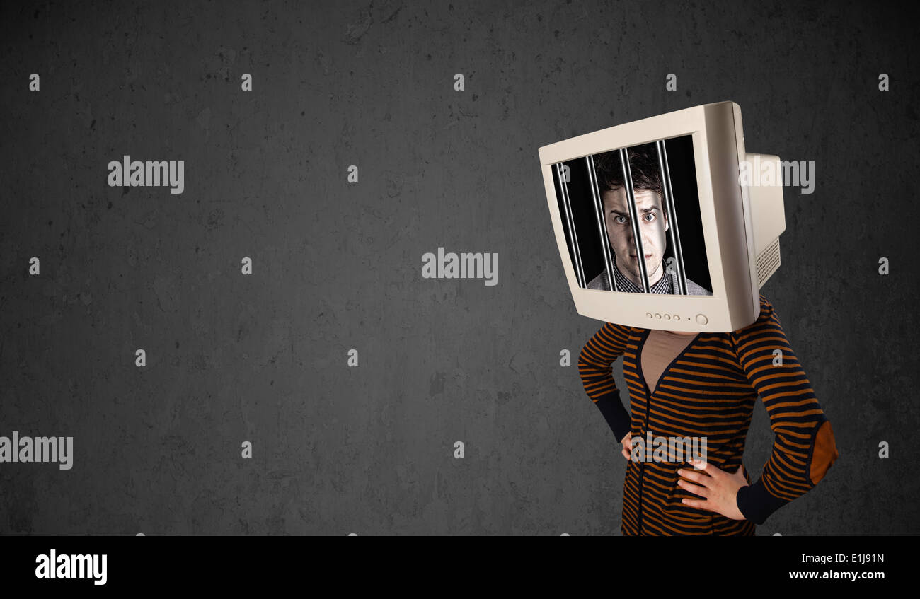 Business man with monitor on his head traped into a digital system ...