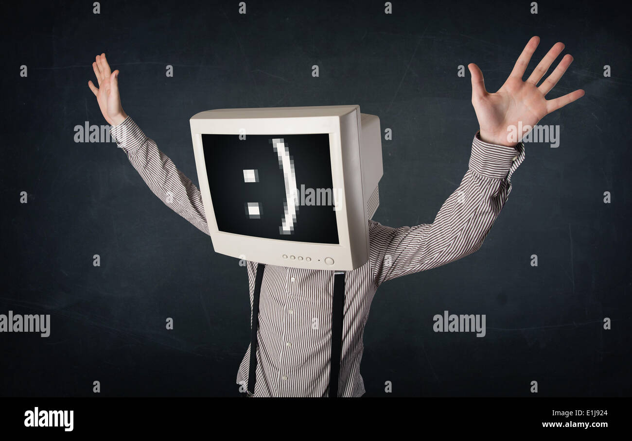 Funny young businessman with a monitor on his head and smiley on the ...