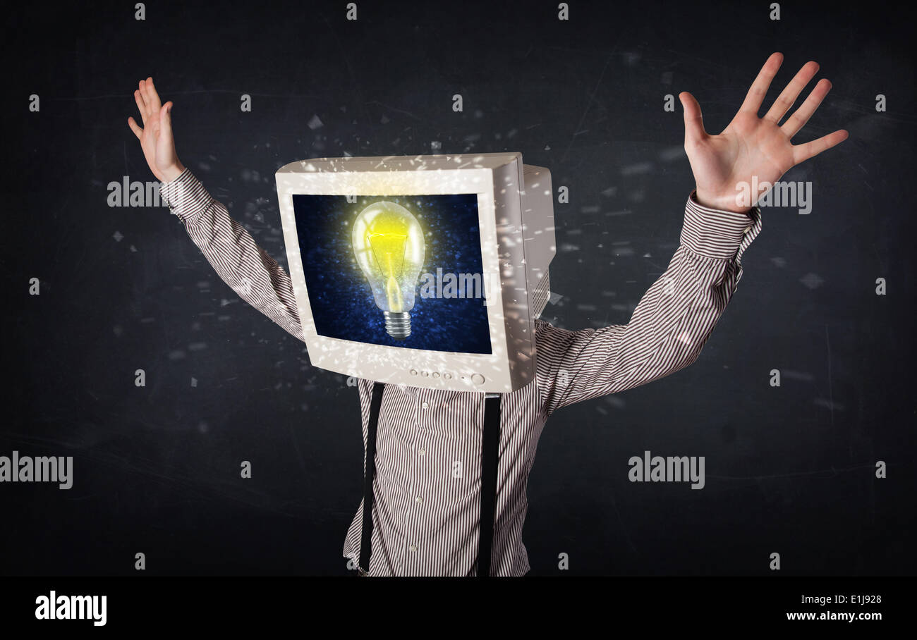 Business man with a pc monitor head and idea light bulb in the display ...
