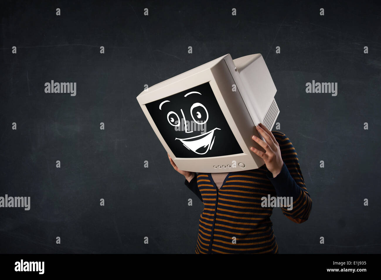 Girl with a monitor head and a cheerful cartoon face Stock Photo - Alamy