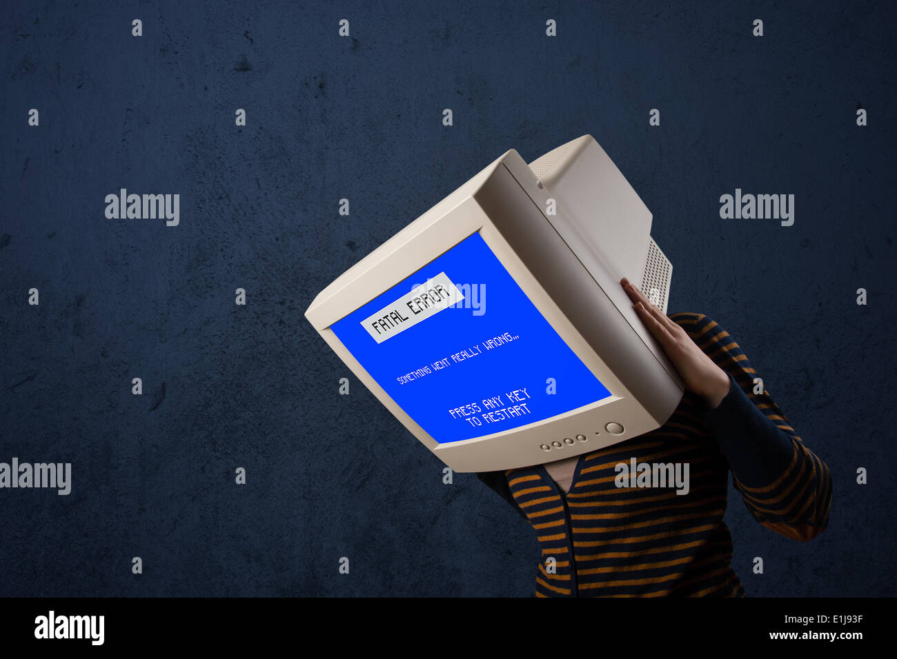 Person with a monitor head and fatal error blue screen on the display ...