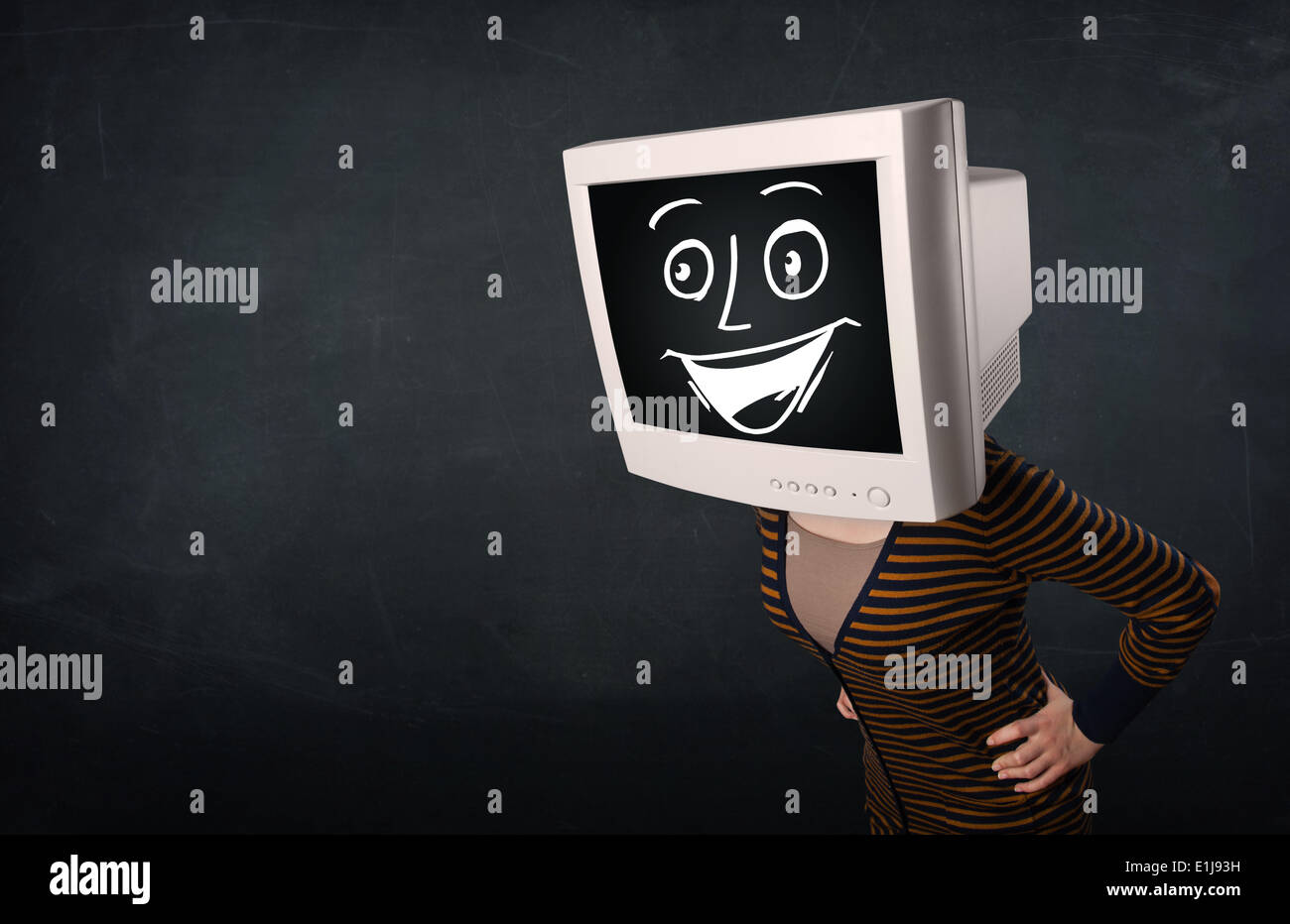 Girl with a monitor head and a cheerful cartoon face Stock Photo - Alamy