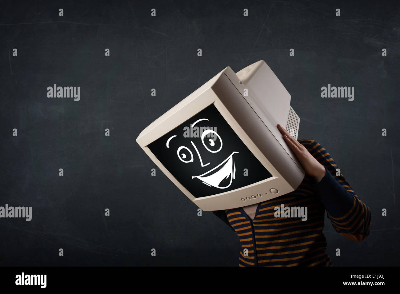 Girl with a monitor head and a cheerful cartoon face Stock Photo - Alamy