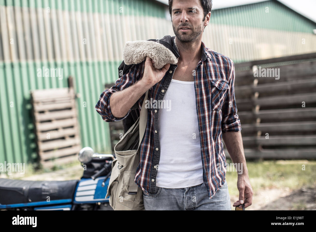 Portrait of man in front of motorcycle Stock Photo - Alamy