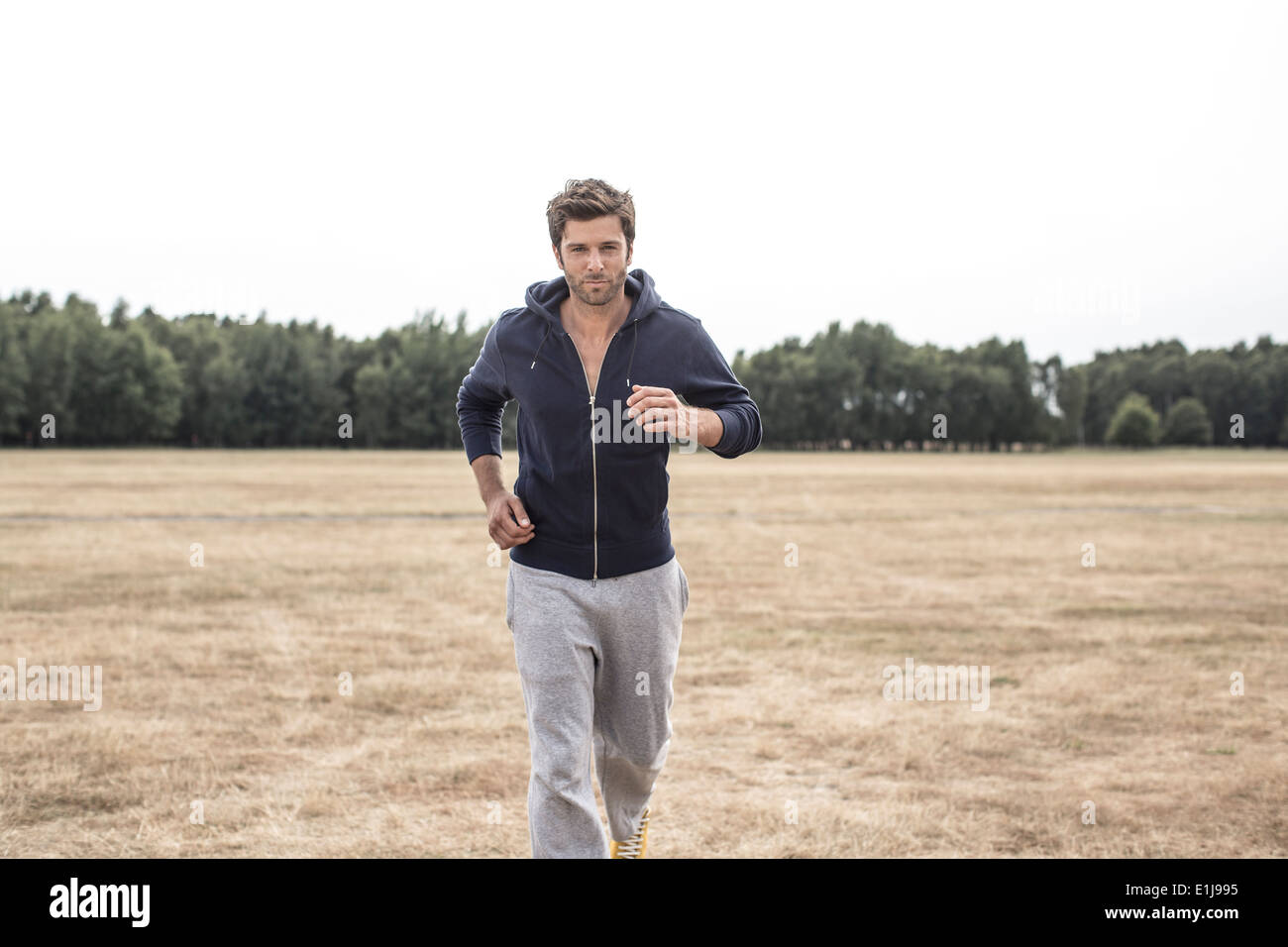 Portrait of jogging man Stock Photo - Alamy