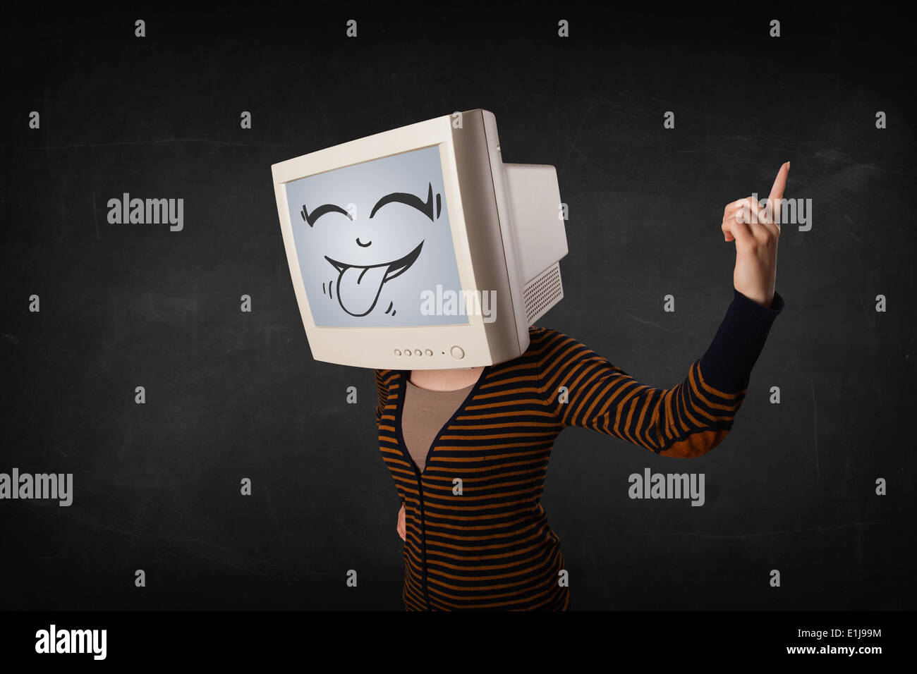 Young girl wearing a monitor with a funny face Stock Photo - Alamy