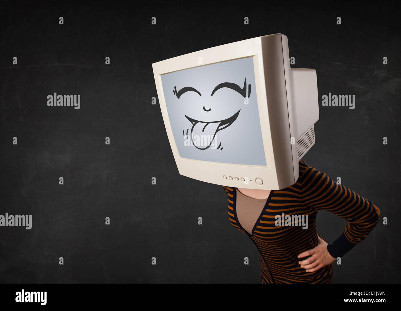 Young girl wearing a monitor with a funny face Stock Photo - Alamy