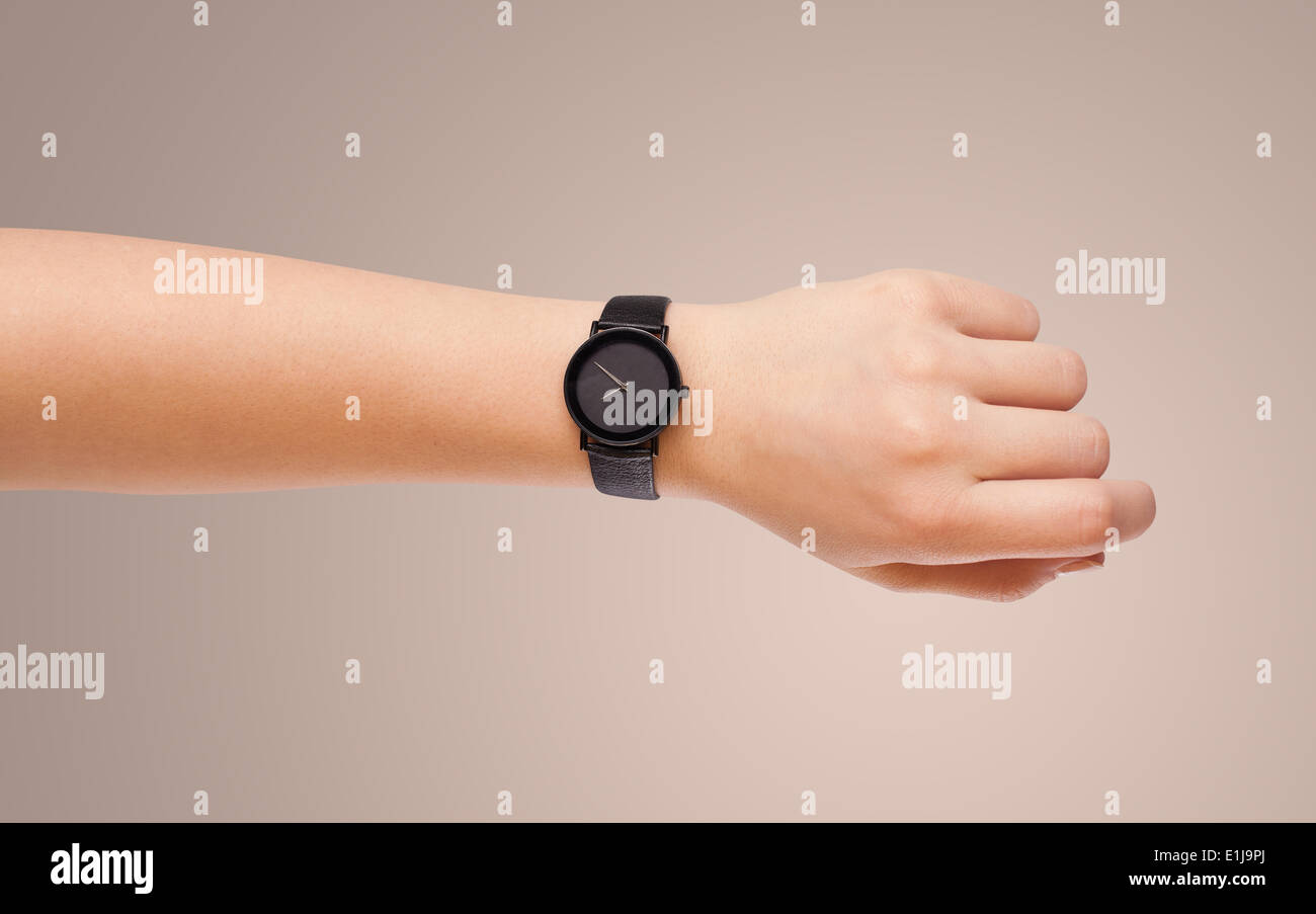 Hand with watch showing precise time Stock Photo - Alamy