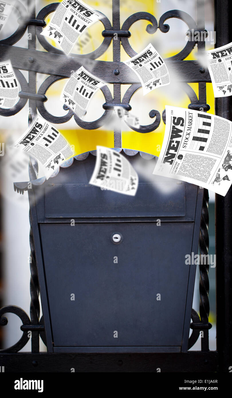 Post box with daily newspapers flying Stock Photo - Alamy