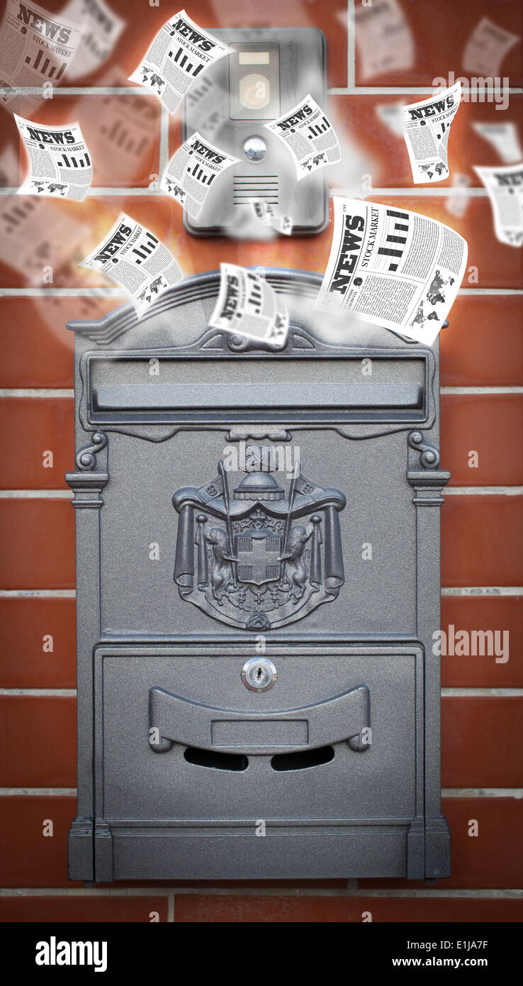 Post box with daily newspapers flying Stock Photo - Alamy