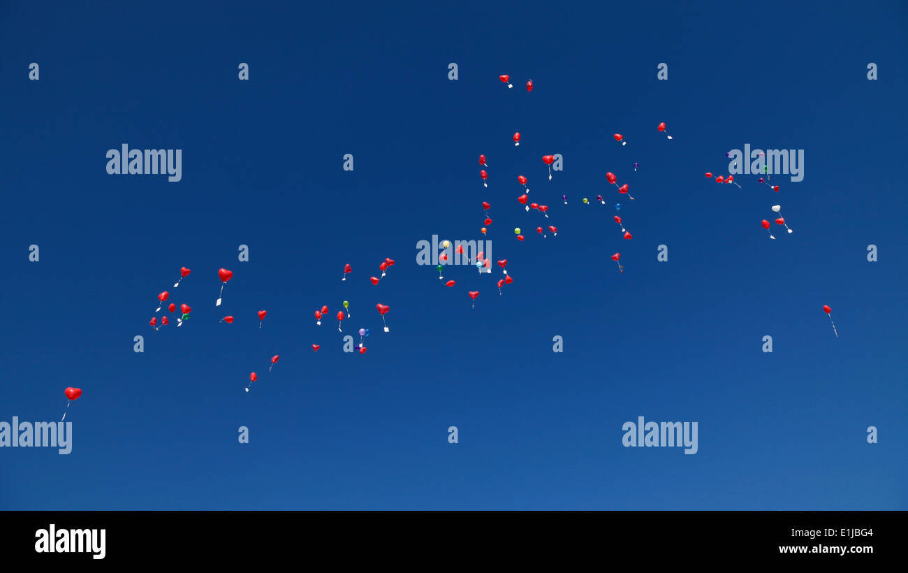 Red balloon message in sky hi-res stock photography and images - Alamy