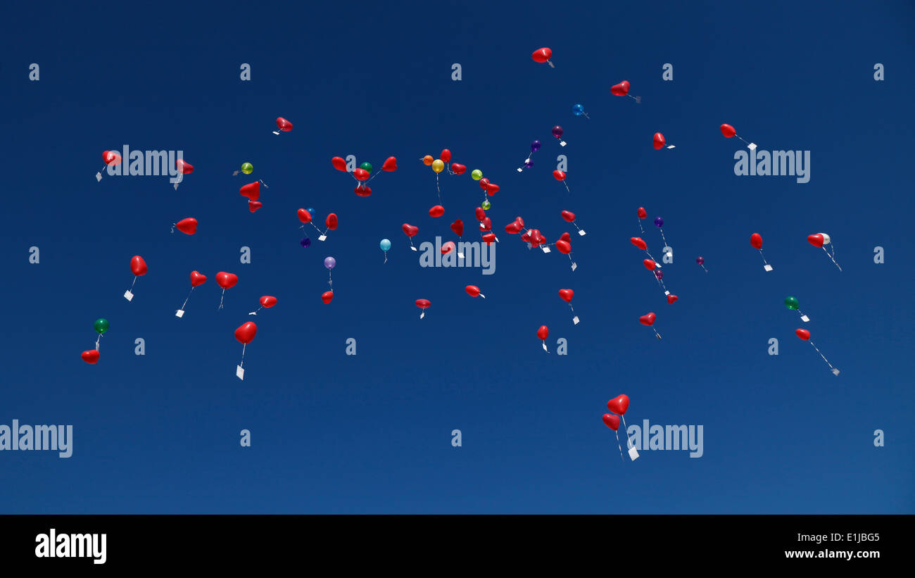 Red balloon message in sky hi-res stock photography and images - Alamy
