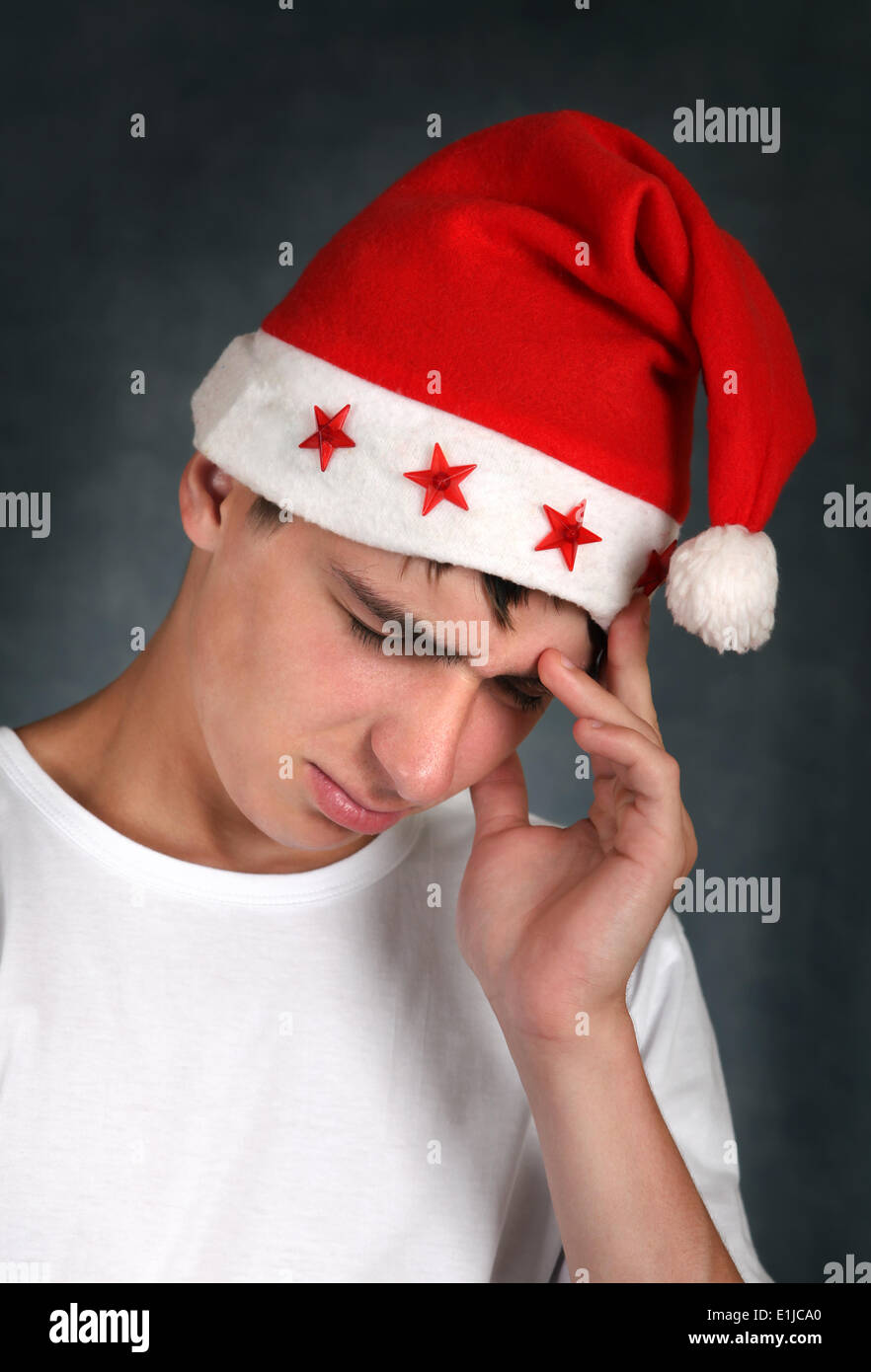 Sad Teenager in Santas Hat Stock Photo - Alamy