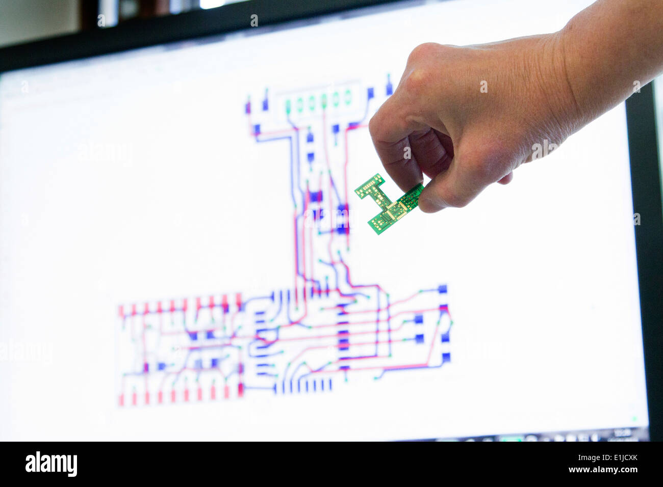 Germany, Hand holding electronic component Stock Photo - Alamy