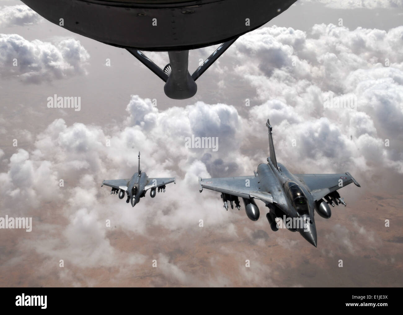 Two French Rafale fighter aircraft prepare to break formation after ...