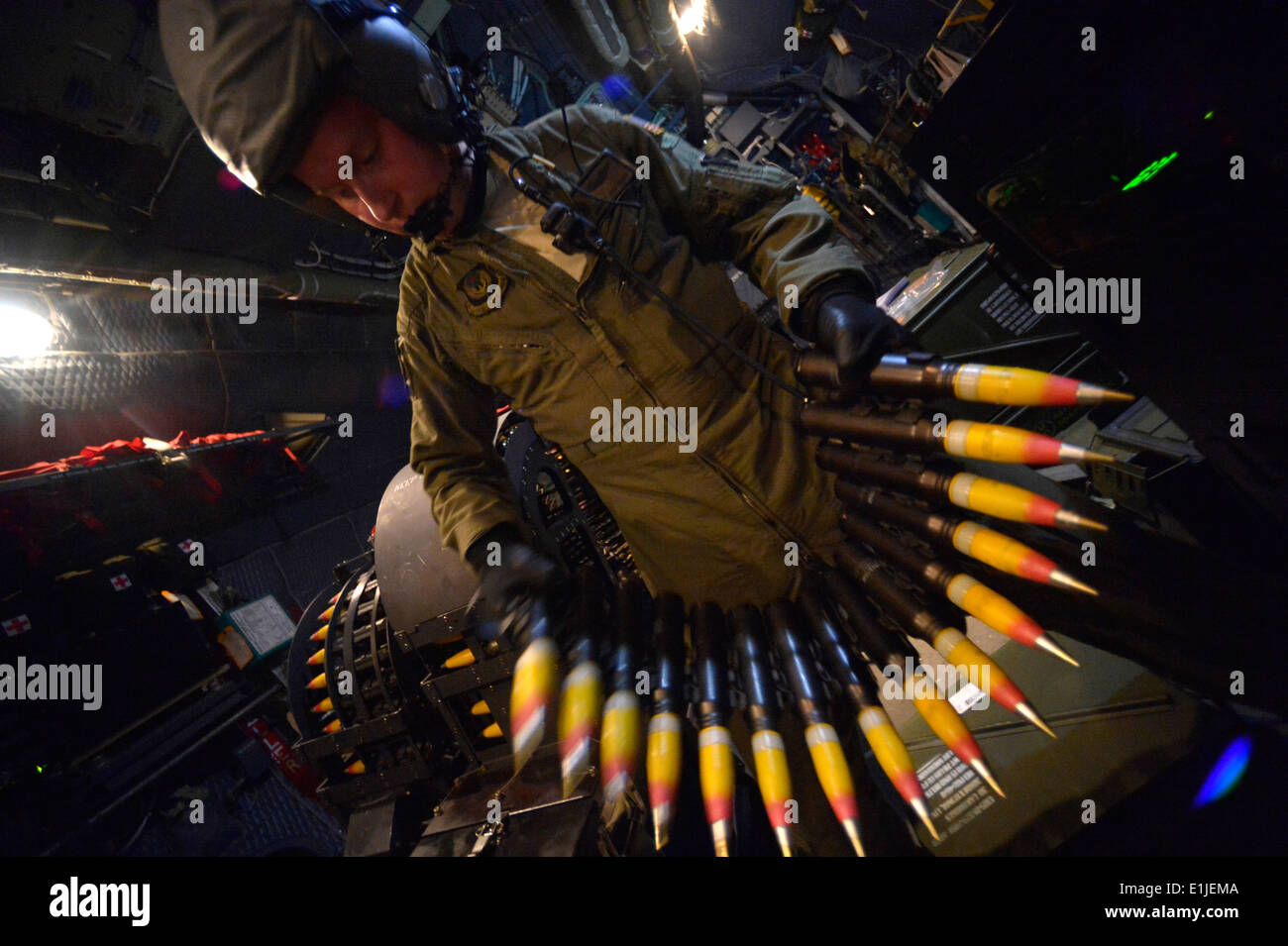 A U.S. Air Force AC-130W Scorpion II aerial gunner reloads 30mm ...