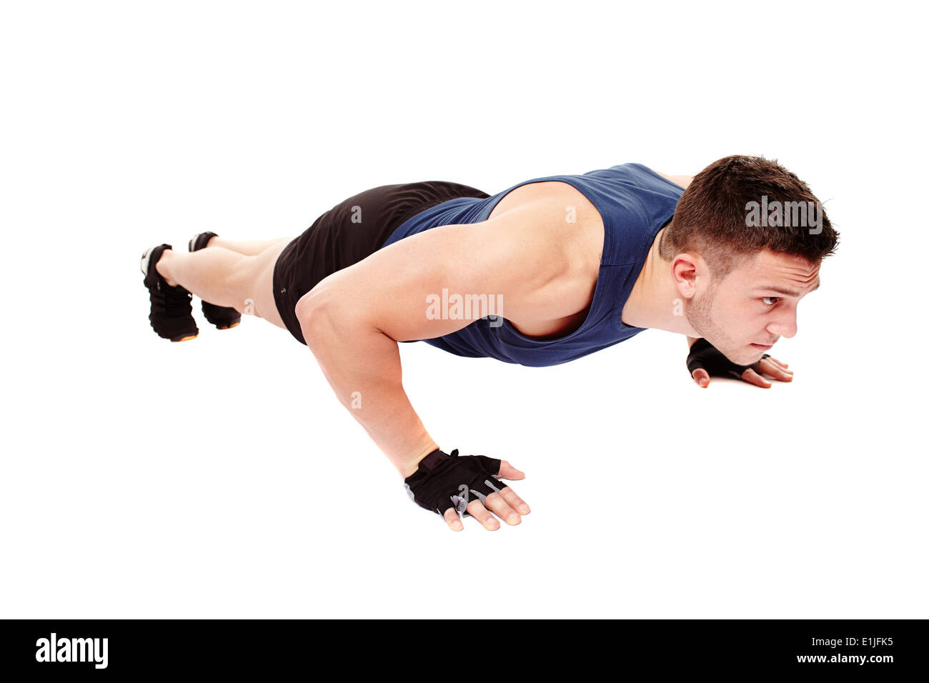 Studio shot of handsome young man doing pushups, isolated over white ...