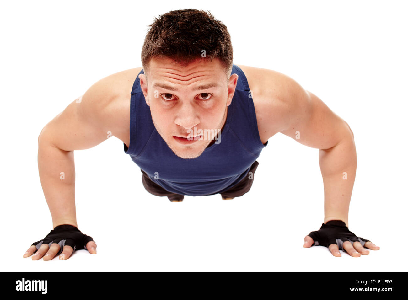 Studio shot of handsome young man doing pushups, isolated over white ...