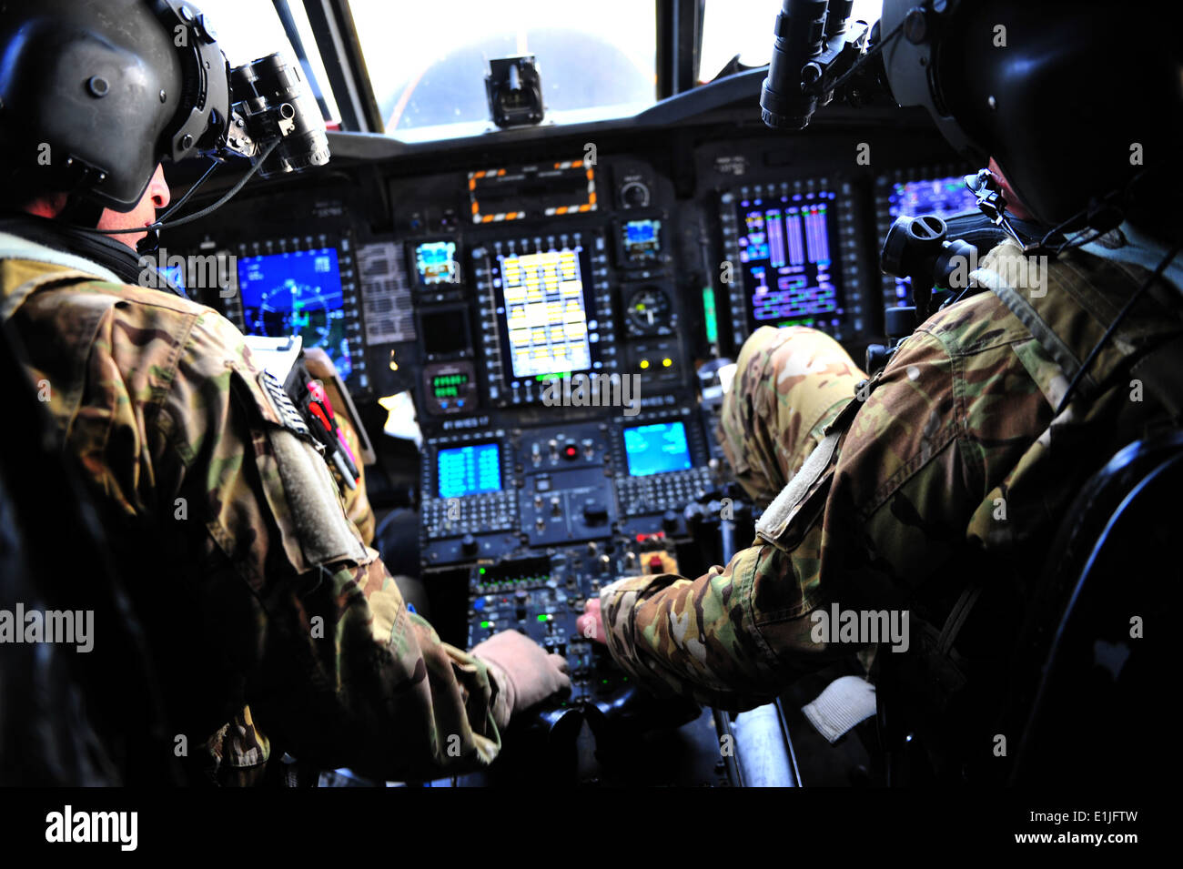 U.S. Army MH-47G Chinook helicopter pilots perform preflight operations ...