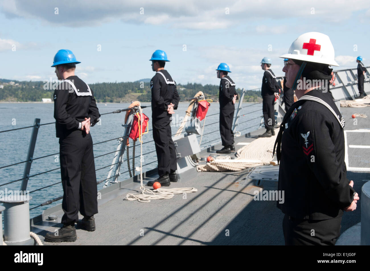 U.S. Sailors aboard the guided missile frigate USS Ford (FFG 54) man ...