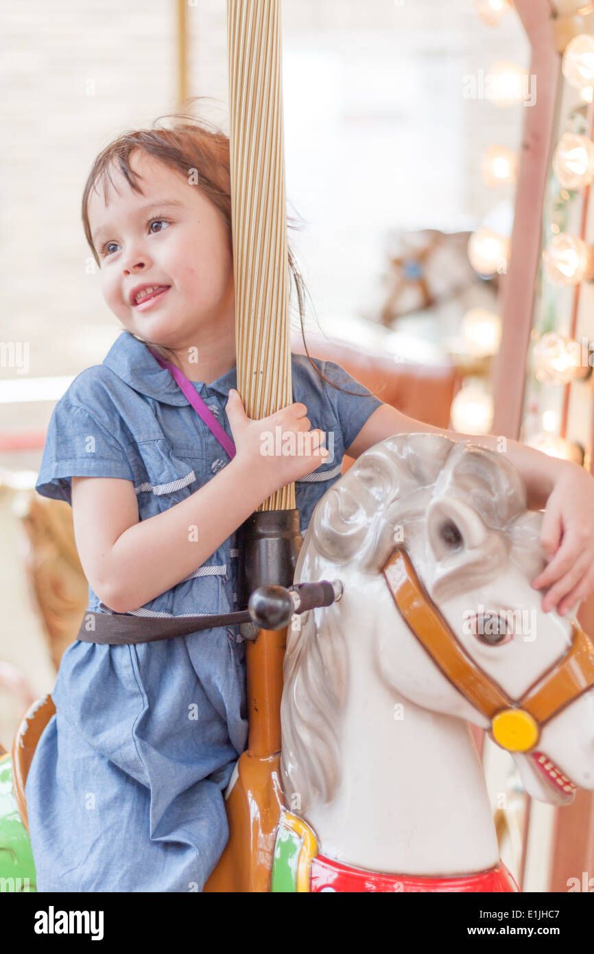 Asian child carousel ride hi-res stock photography and images - Alamy
